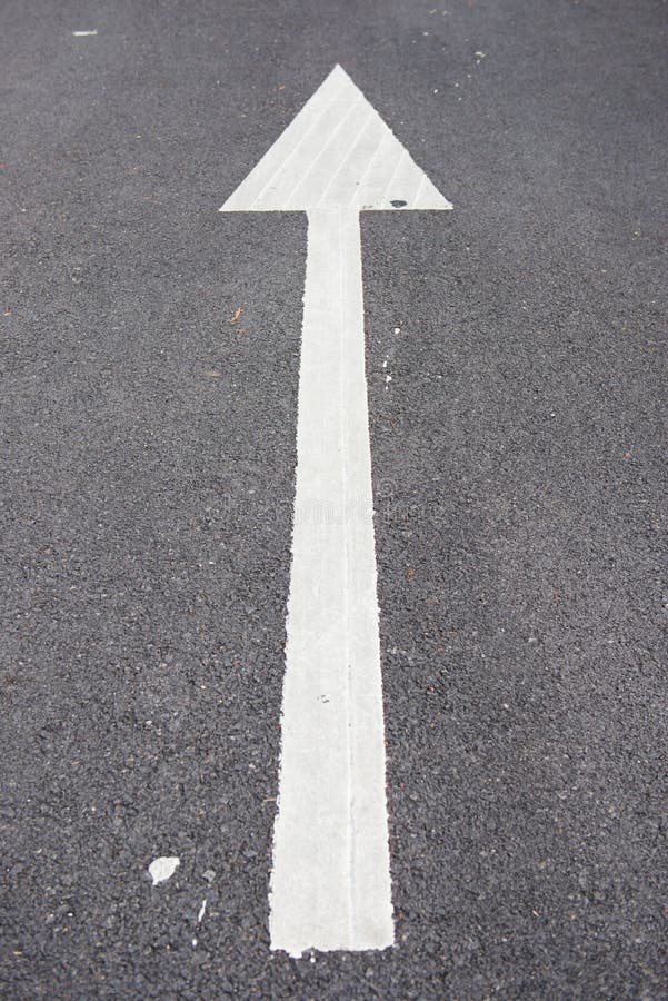 White Arrow Point on the Road Stock Photo - Image of area, texture ...