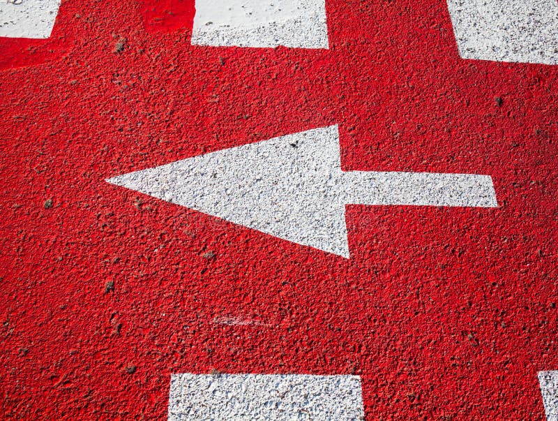 White Arrow on the Red Asphalt Surface Stock Image - Image of left ...