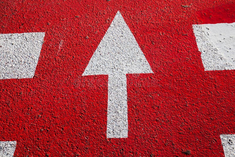 White Arrow on the Red Asphalt Surface Stock Photo - Image of arrow ...
