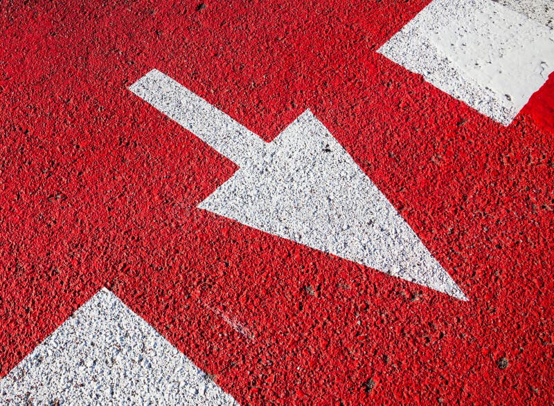 White Arrow on the Red Asphalt Surface Stock Image - Image of paint ...