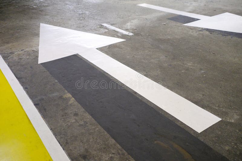 White Arrow Sign on the Concrete Road. Stock Image - Image of black ...