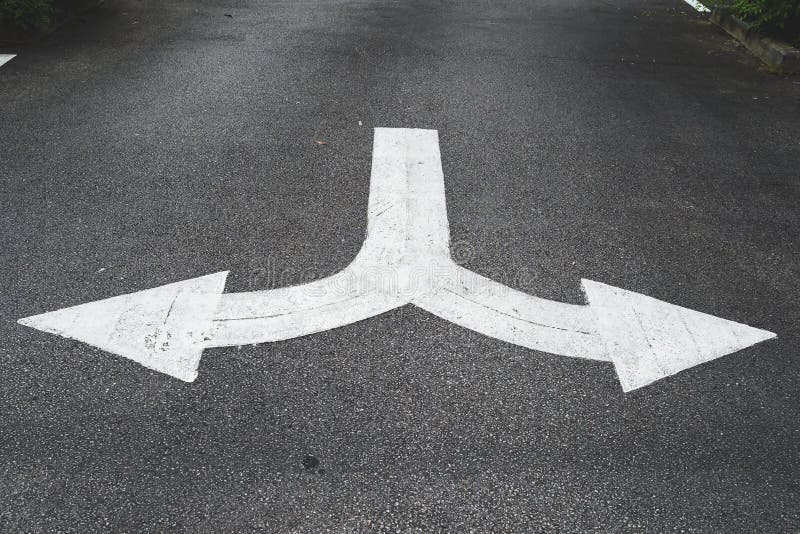 White Arrow Symbols Pointing Left and Right Give Directions on the Road ...