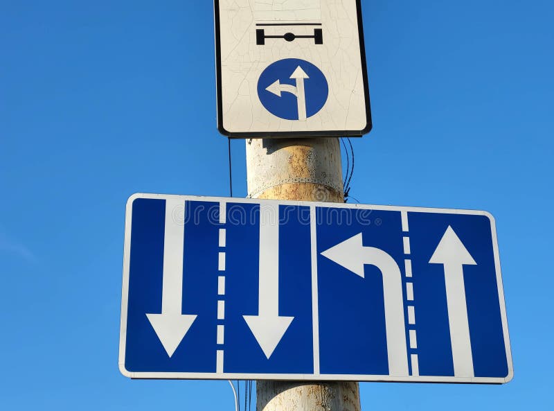 White Arrows on a Blue Background are a Standard Road Sign on a ...