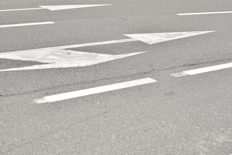 White arrows on the road stock photo. Image of highway - 330889894