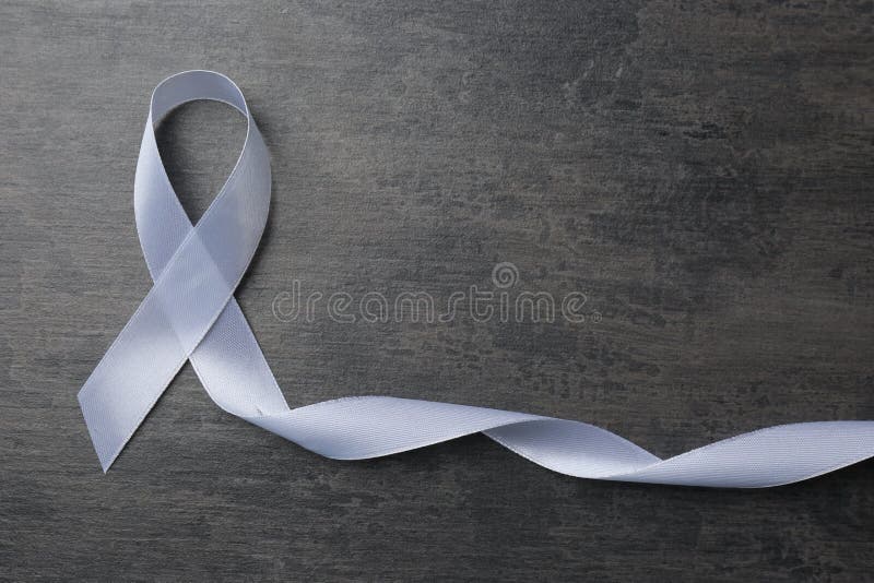 White Awareness Ribbon on Grey Table, Top View. Space for Text Stock ...