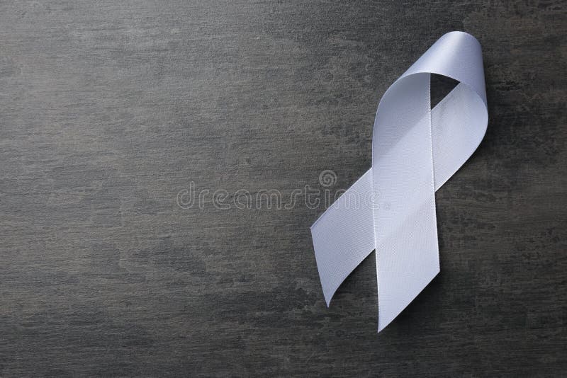 White Awareness Ribbon on Grey Table, Top View. Space for Text Stock ...