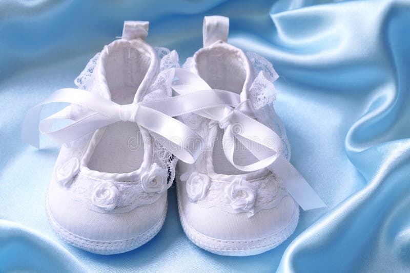 White baby booties stock image. Image of blue, satin - 16856975