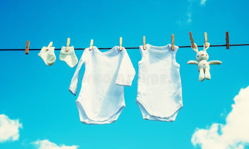 White Baby Clothes Dry on a Rope. Selective Focus Stock Photo - Image ...