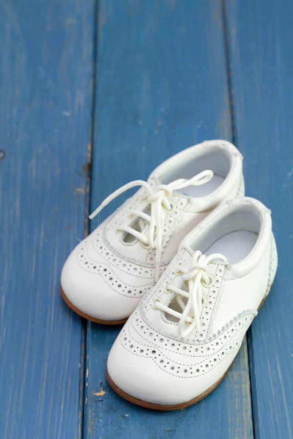 White baby shoes stock photo. Image of flower, detail - 15421620