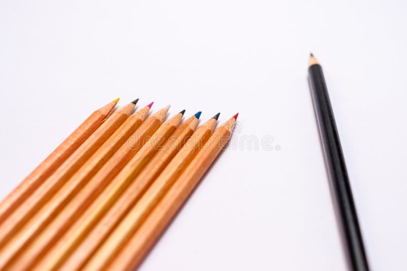 White Background with an Arrangement of Colored Pencils and a Separate ...