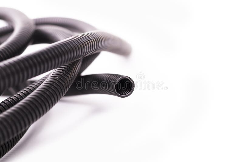 On a White Background. Black Corrugated Tube for Laying Cable in the ...