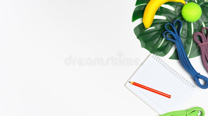 White Background and Resistance Loop for Exercise, Notebook for Workout ...