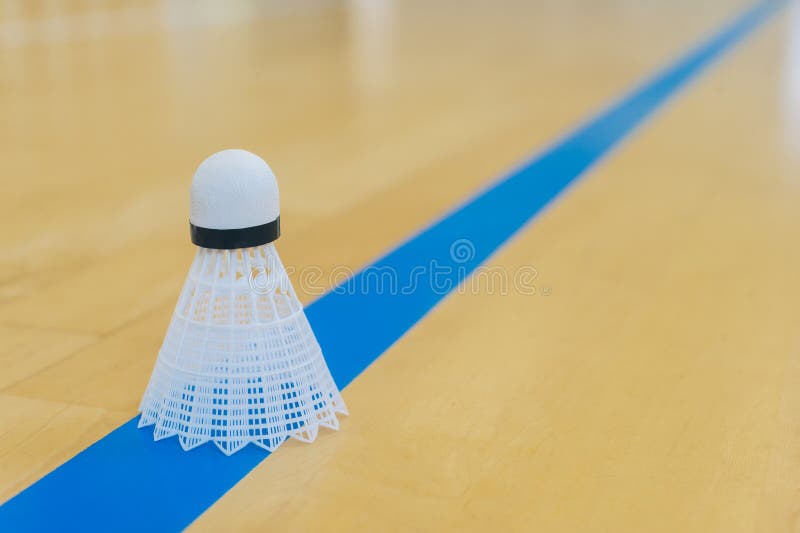 White Badminton Shuttlecock on a Blue Line Hall Floor at Badminton ...