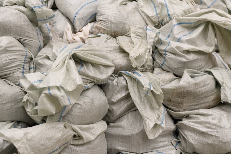 White Bags with Construction Debris. Flood Barrier Stock Image - Image ...