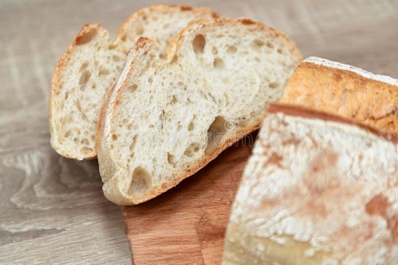 White Baked Bread and Chopped Pieces Stock Photo - Image of bread ...