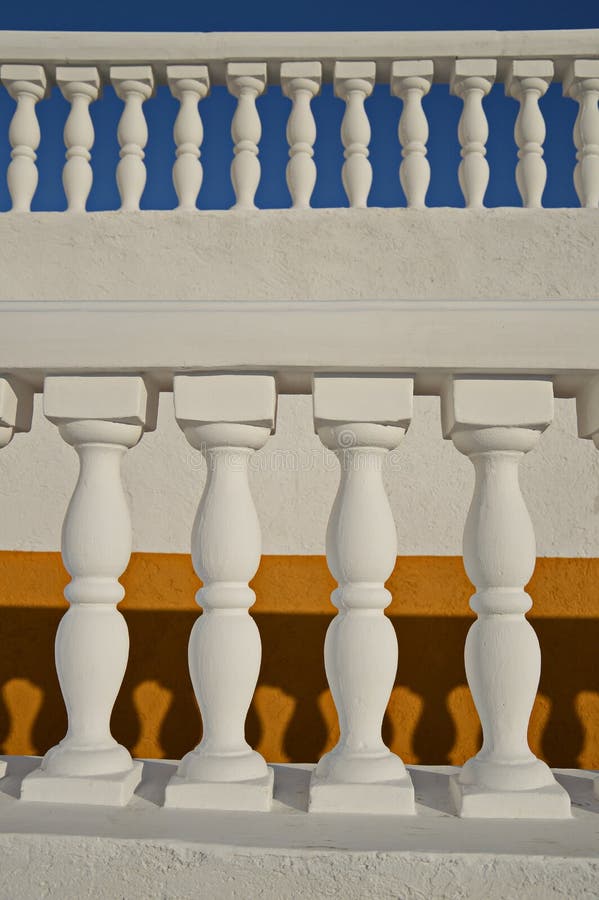 White Balusters on the Yellow and Blue Backgrounds Stock Image - Image ...