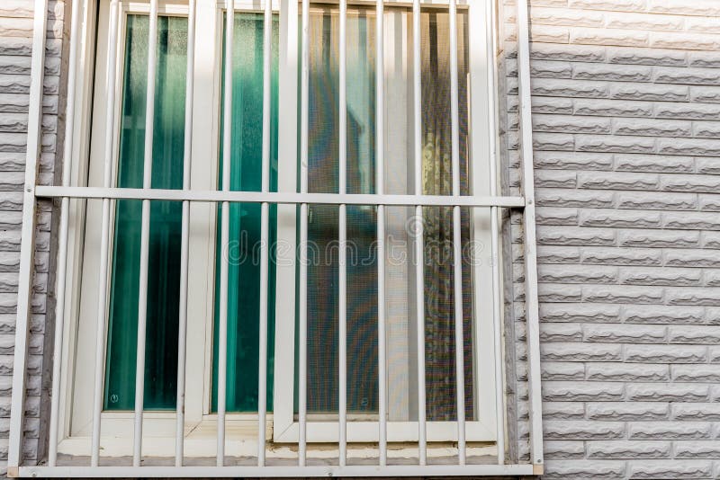 Bars installed over window stock image. Image of iron - 167992553
