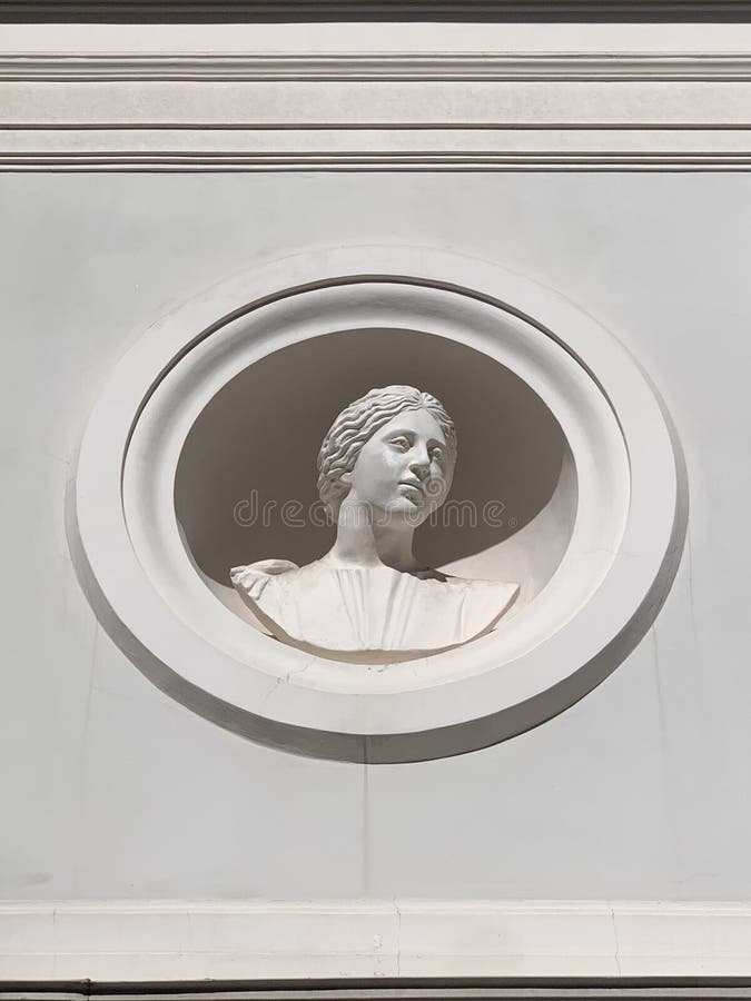 White Bas-relief of a Womans Bust Framed in a Circular Niche on a White ...