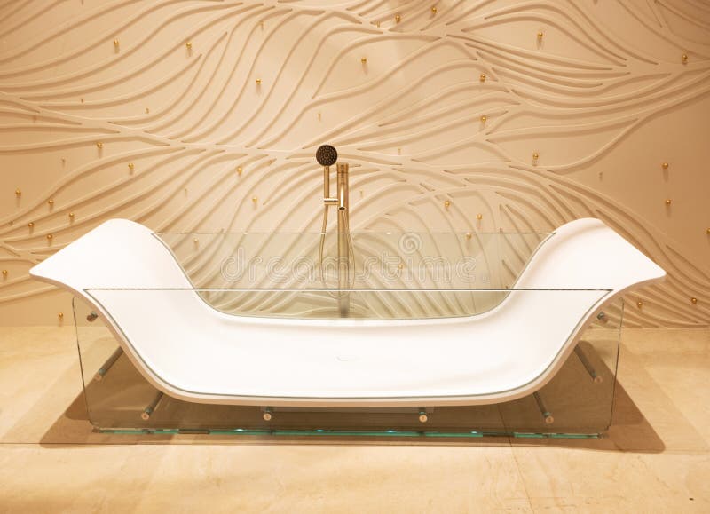 White Bath with Glass with Gold Tap in a Modern Style. Bathroom Design ...