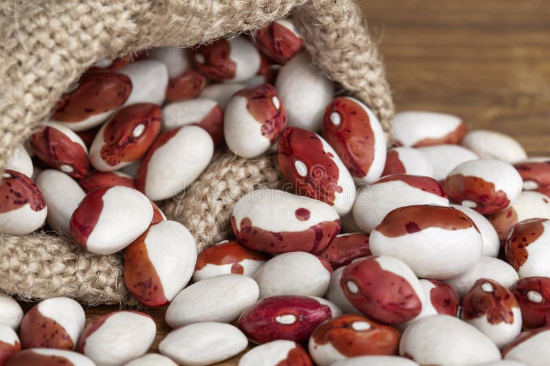 White Beans with Red Spots in Bags on a Wooden Table Stock Image ...