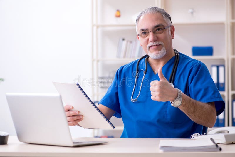 The White Bearded Old Doctor Working in Clinic Stock Image - Image of ...