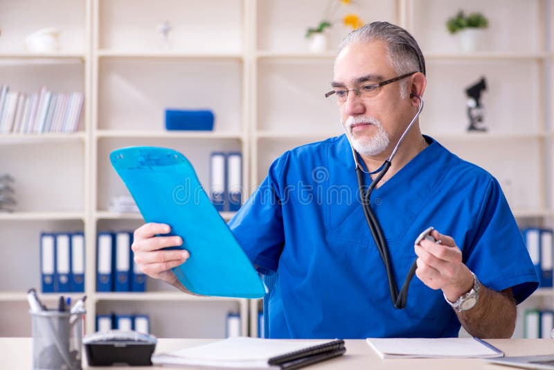 The White Bearded Old Doctor Working in Clinic Stock Photo - Image of ...