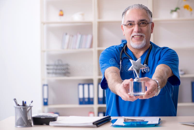 The White Bearded Old Doctor Working in Clinic Stock Image - Image of ...