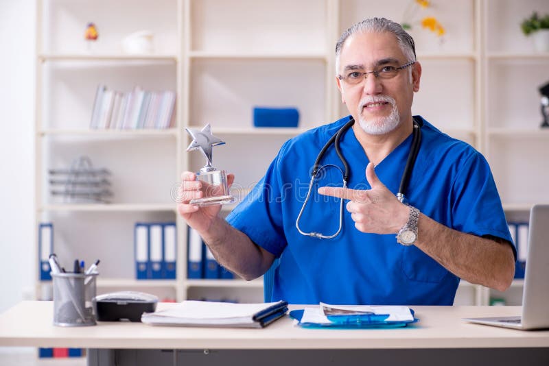 The White Bearded Old Doctor Working in Clinic Stock Image - Image of ...