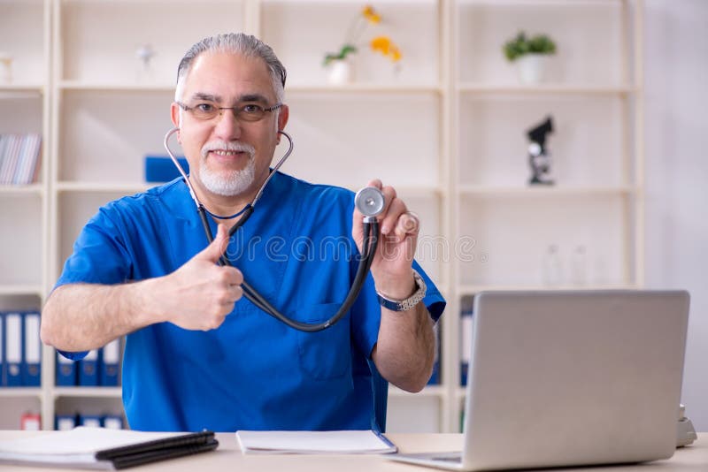 The White Bearded Old Doctor Working in Clinic Stock Image - Image of ...