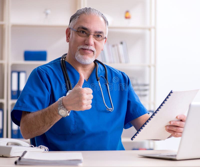 White Bearded Old Doctor Working in Clinic Stock Image - Image of case ...