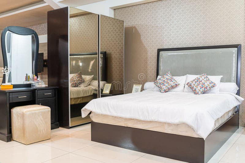 A White Bed and Glass Wardrobe on the Side Editorial Stock Photo ...