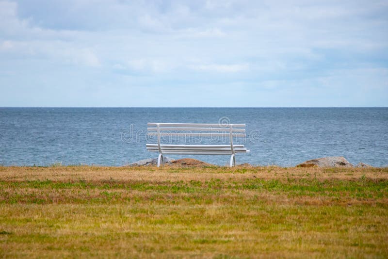 White Bench on a Seaside with a Beautiful Sea View and Blue Sky on the ...