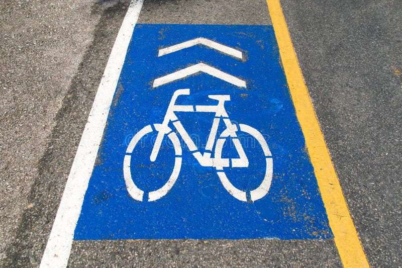 White Bicycle and Arrow Sign on Blue Background Road Stock Image ...