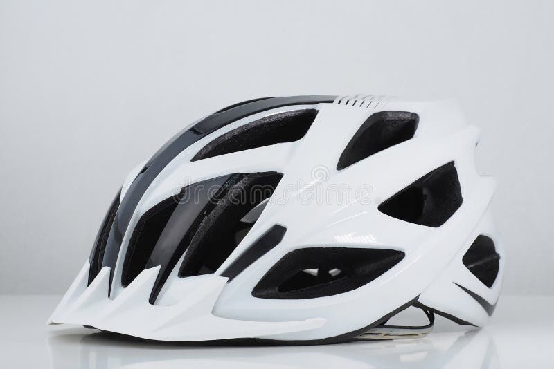 White Bicycle Helmet and Sports Sunglasses on a Dark Background. Stock ...
