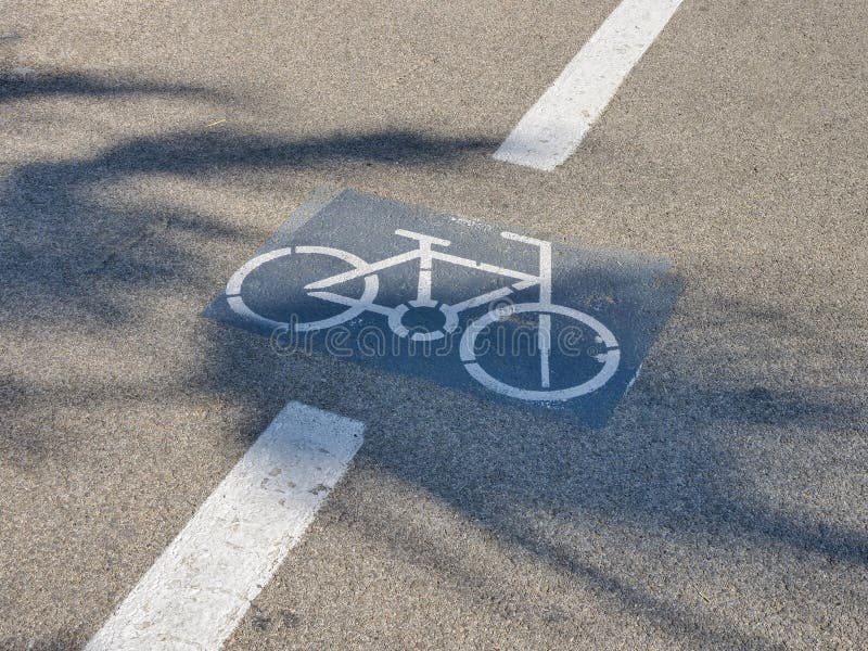 White Bicycle Lane Mark on an Asphalt Road. Stock Photo - Image of ...
