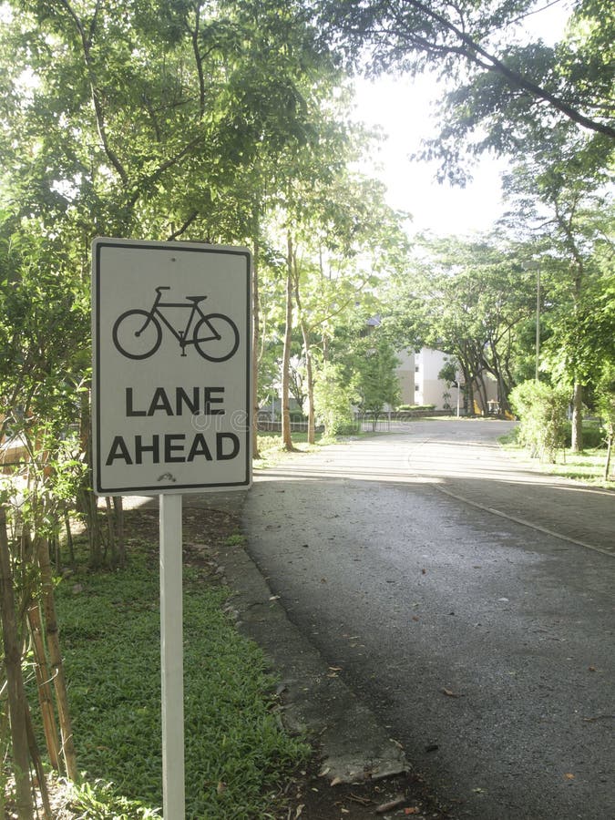 White Bicycle Lane Sign on the Park Stock Image - Image of path, road ...