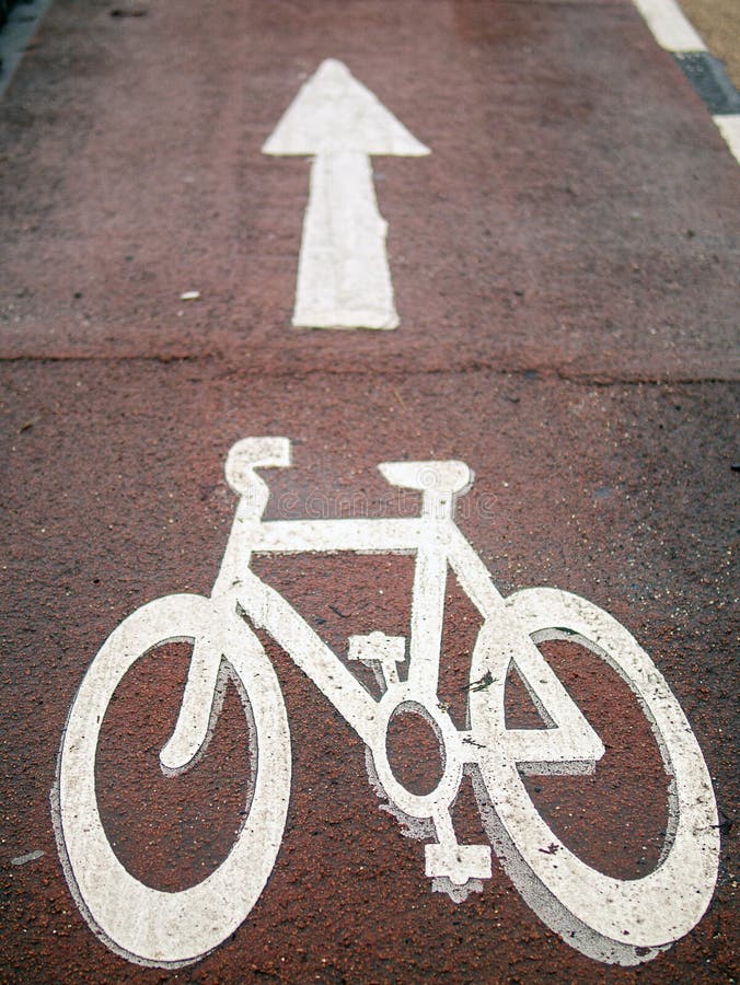 White Bicycle Sign and Arrow on Red Color Asphalt Road Stock Image ...