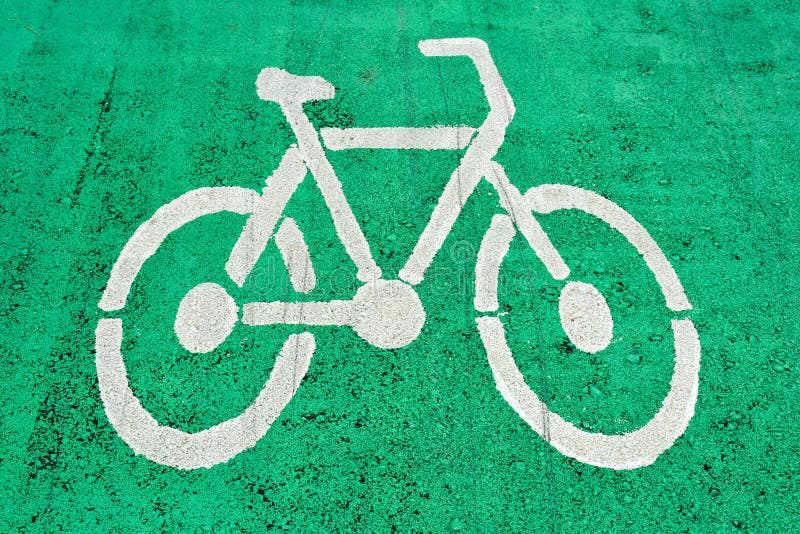 White Bicycle Sign Painted on an Green Asphalt Road. Stock Photo ...