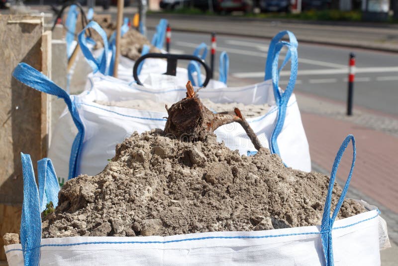 White Big Bulk Bags Filled with Soil on the Street. Stock Image - Image ...