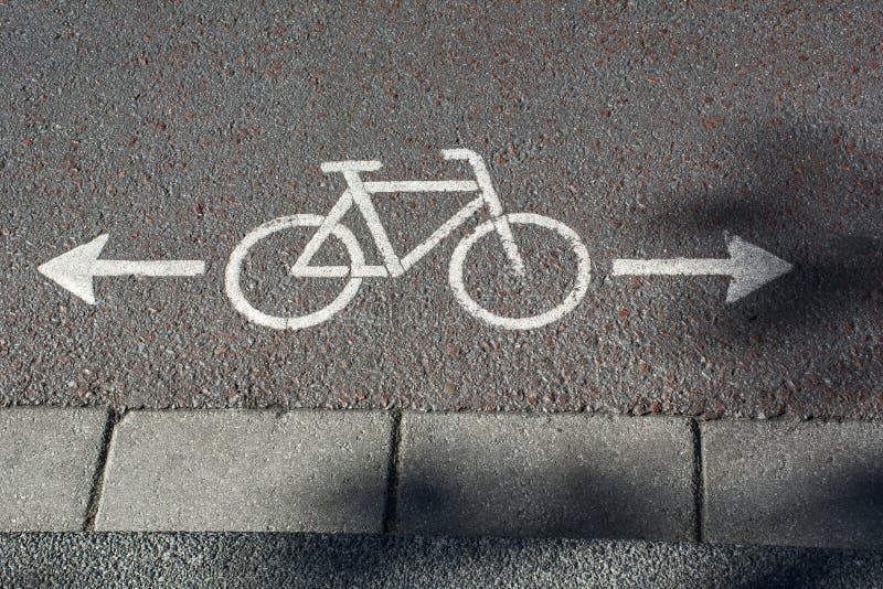 White Bike Sign on the Pavement Stock Photo - Image of sign ...