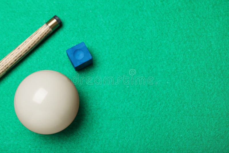 White Billiard Ball, Chalk and Cue on Green Table, Flat Lay. Space for ...