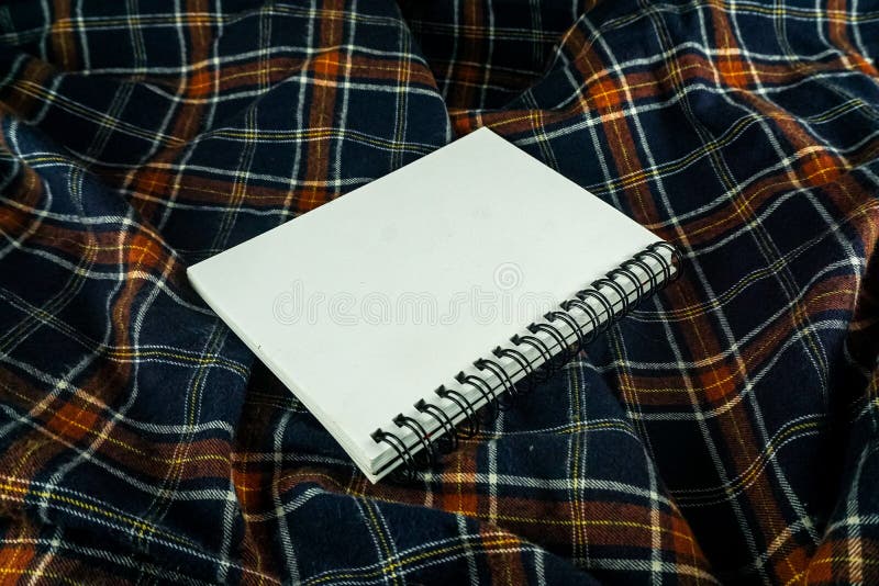 White Binder Book on Cloth with Gingham Stock Photo - Image of ...