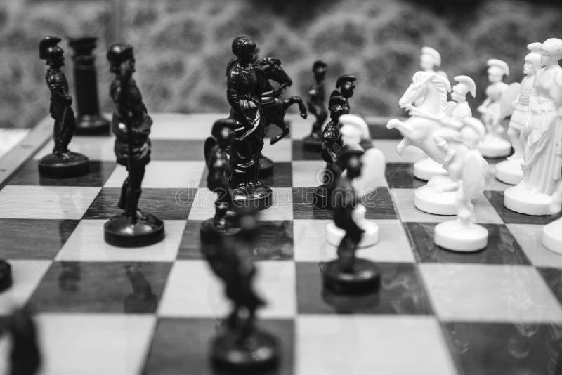 White and Black Chess Pieces Stand on the Board during a Chess Game ...