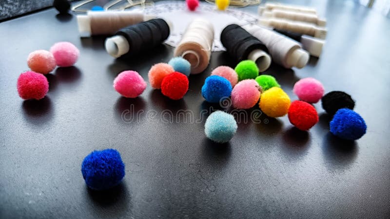 White and Black Spools of Thread with Decorative Napkin and Colored ...