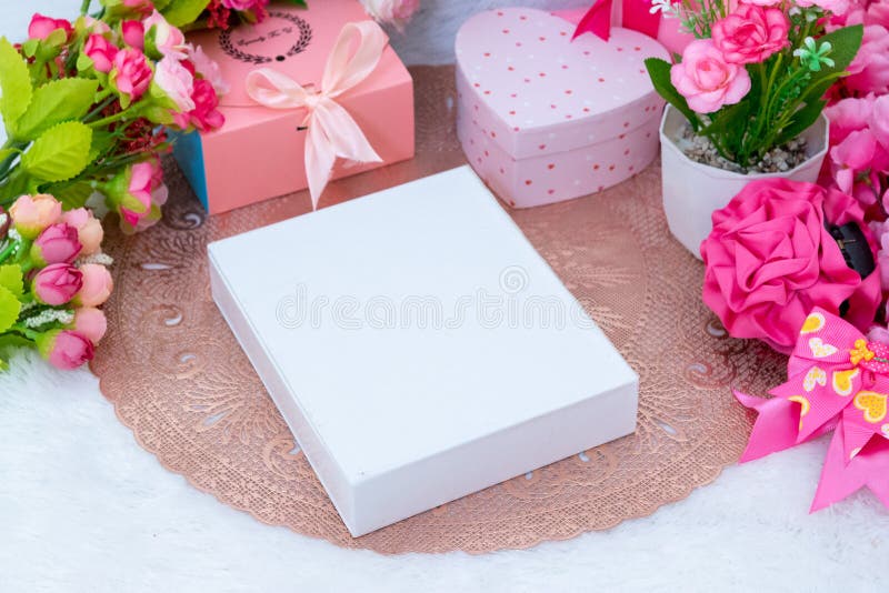 White Blank Rectangle Box Above a Small Tablecloth Surrounded by ...