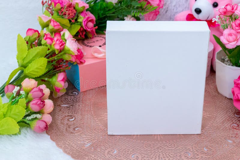 White Blank Rectangle Box Above a Small Tablecloth Surrounded by ...