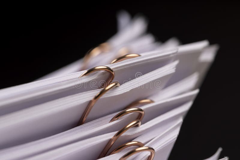 White Blank Sheets of Paper Connected by Copper Staples Stock Image ...