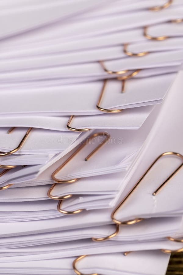 White Blank Sheets of Paper Connected by Copper Staples Stock Image ...