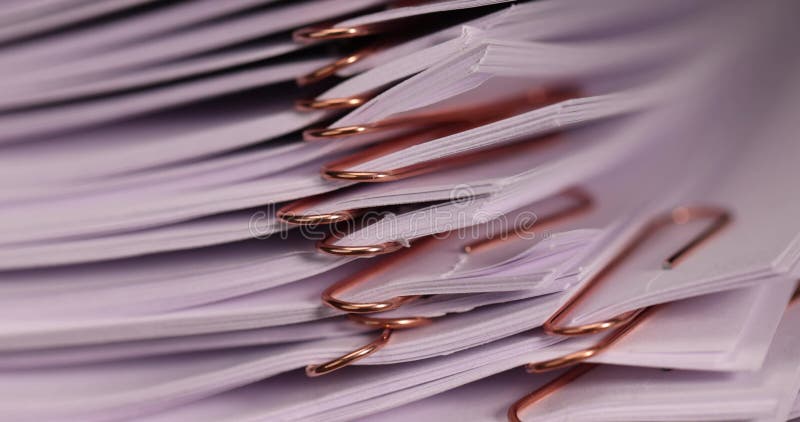 White Blank Sheets of Paper Connected by Copper Staples Stock Video ...