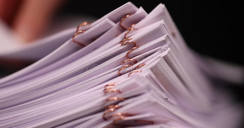 White Blank Sheets of Paper Connected by Copper Staples Stock Video ...